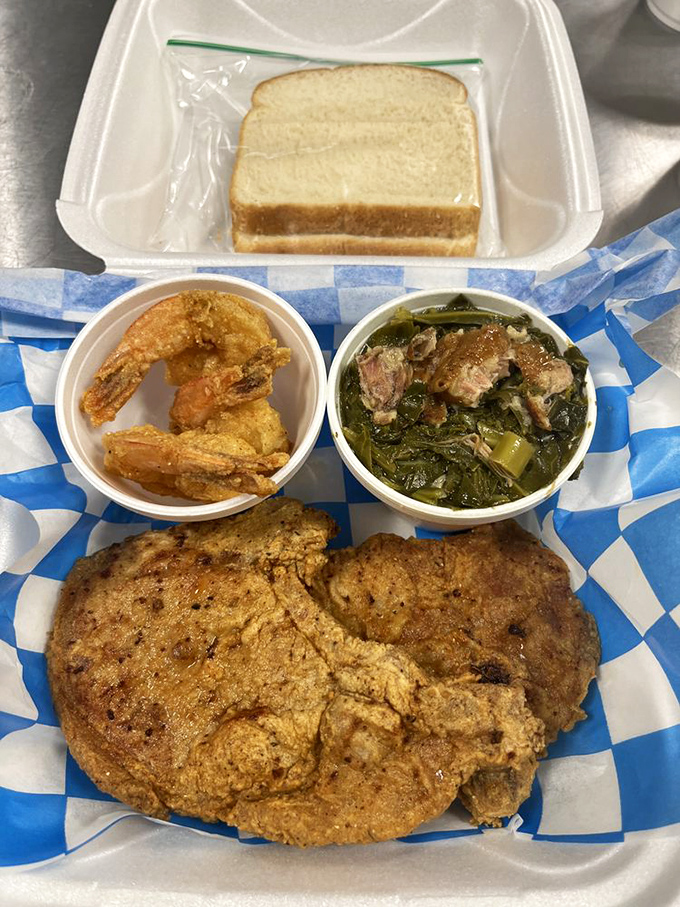 Soul food symphony: crispy pork, collard greens swimming with flavor, and shrimp that could make you forget you're hundreds of miles from any ocean.