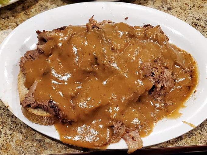 Pot roast swimming in gravy so rich it probably has its own accountant. This isn't just comfort food &ndash; it's emotional support on a plate. 