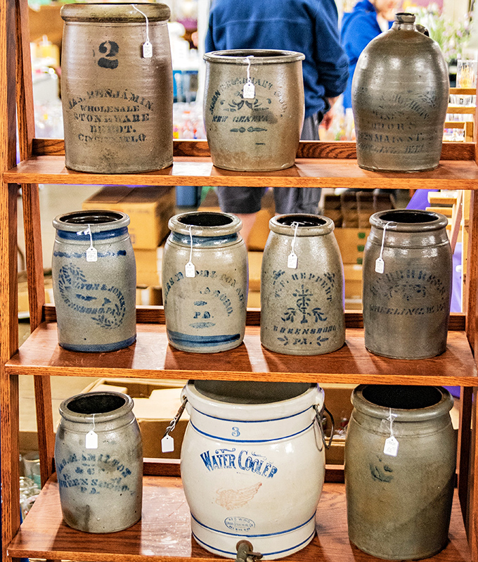 Stoneware soldiers standing at attention, these blue-decorated crocks once stored everything from pickles to moonshine before becoming living room trophies.