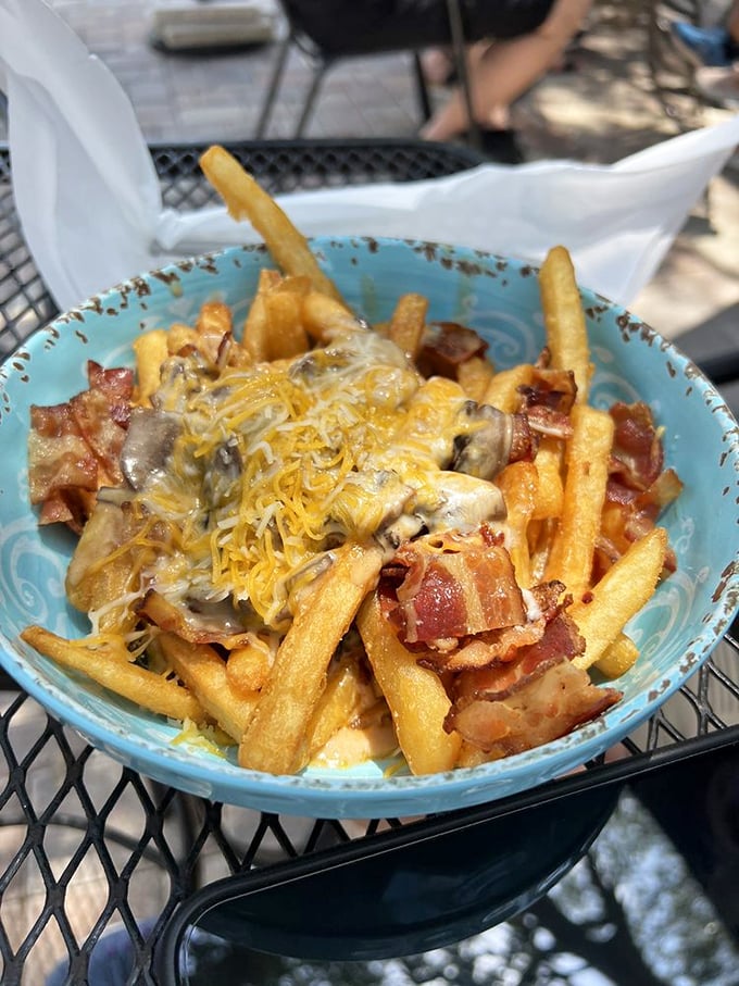 Poutine that would make a Canadian weep with joy. Those fries have found their purpose in life beneath a blanket of cheese, bacon, and mushroom gravy