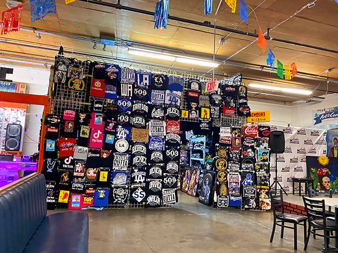 A visual symphony of graphic tees creates a wall of wearable art, from regional pride to pop culture references that speak volumes without saying a word.