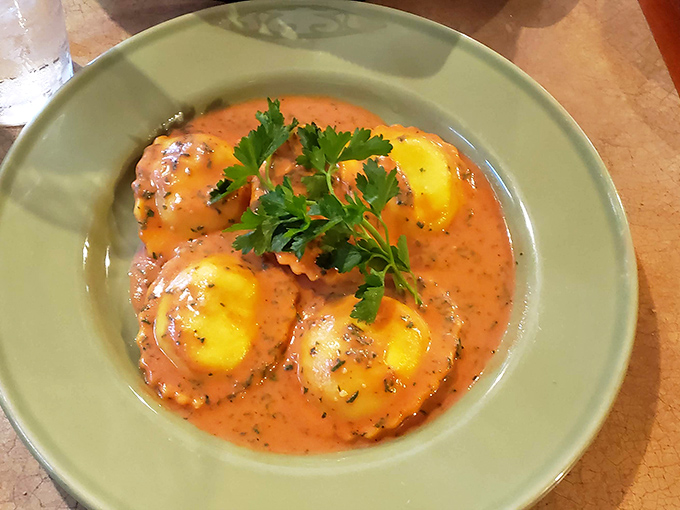 These ravioli aren't just swimming in sauce&mdash;they're doing the backstroke in flavor heaven. Pillowy pasta islands in a sea of rich, herb-flecked tomato bliss. 