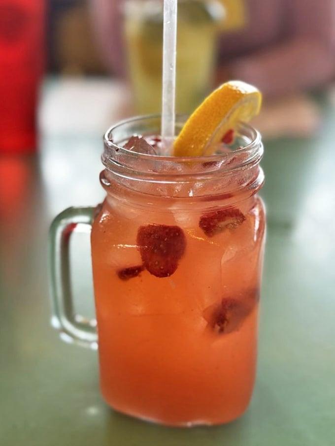 This isn't just a drink; it's Florida sunshine captured in a mason jar, with berries and citrus playing supporting roles. 