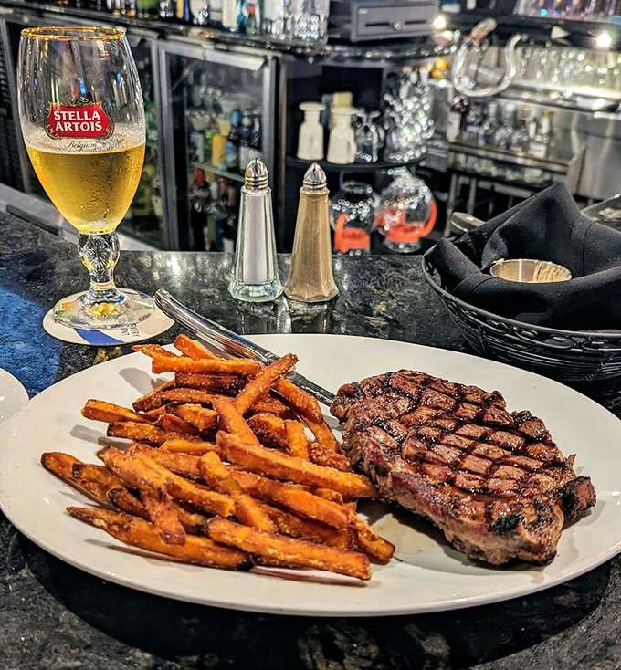 Sweet potato fries and a perfectly grilled ribeye&mdash;proof that sometimes the simplest combinations create the most profound happiness.