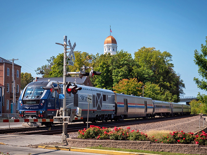 All aboard! The Amtrak River Runner passes through Hermann with the town's distinctive copper dome playing backdrop. Train travel never had a more picturesque photo opportunity.