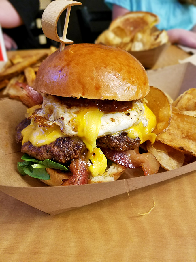 Morning egg meets afternoon burger in this breakfast-lunch romance topped with cheese that's not just melted—it's surrendered completely.