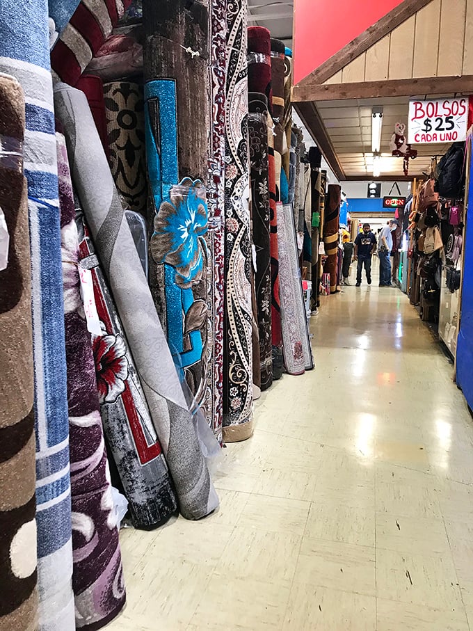 The rug section: where floor coverings hang like tapestries in a medieval castle, each pattern promising to tie your room together, Lebowski-style.