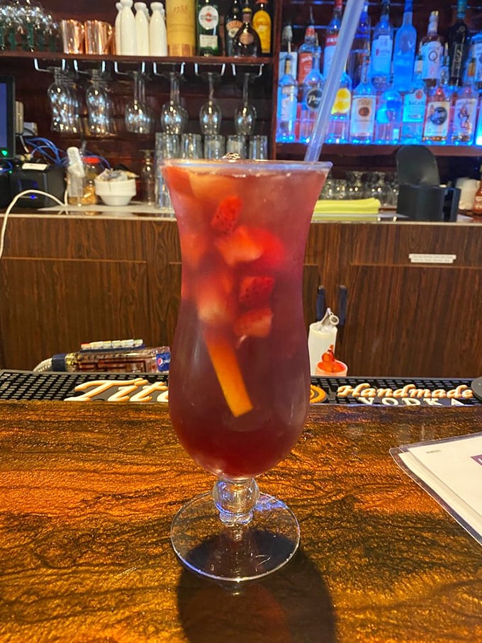 A ruby-red sangria that looks like it belongs in the hand of someone making questionable but delicious vacation decisions.