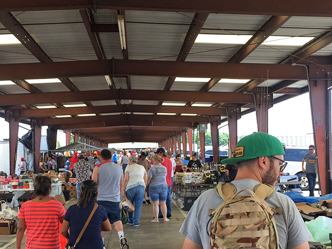 Weekend warriors navigate the covered marketplace, each with their own quest. Some hunt antiques, others seek bargains, all find stories.