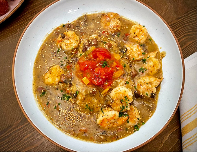 Shrimp and grits that would make a Lowcountry grandmother both proud and a little jealous. That's not just a dish—it's a Charleston handshake.