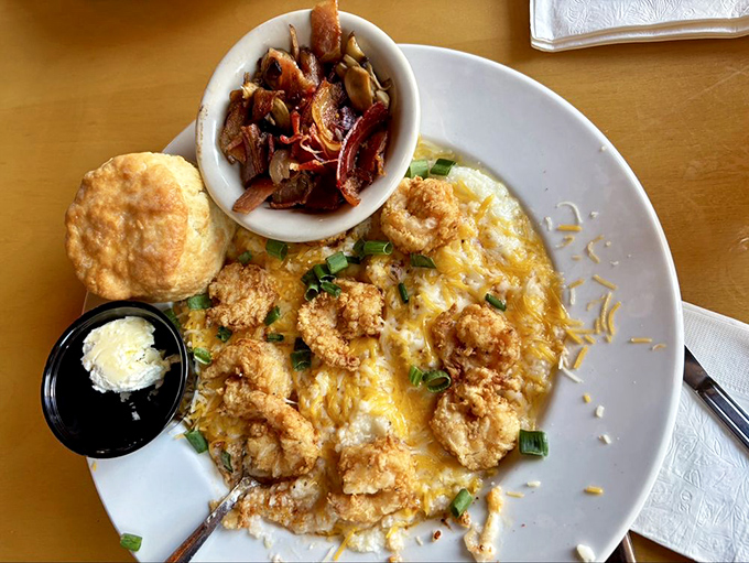 Shrimp and grits: where ocean meets cornfield in a creamy, cheesy romance. This dish doesn't just speak Southern&mdash;it sings it with perfect pitch.