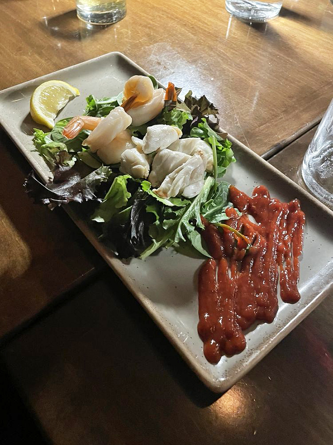 Ocean treasures nestled on fresh greens with artistic sauce flourishes&mdash;seafood this elegant makes Monday feel like Saturday night.