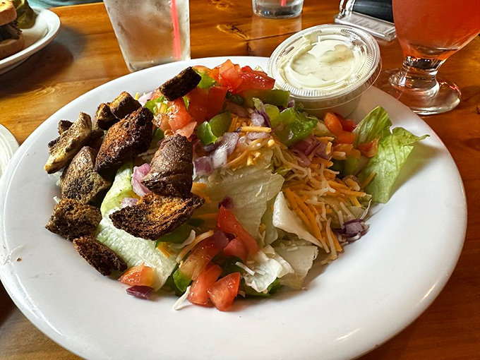 A fresh side salad provides the perfect counterpoint to sandwich indulgence. Even vegetables taste better in the presence of greatness.