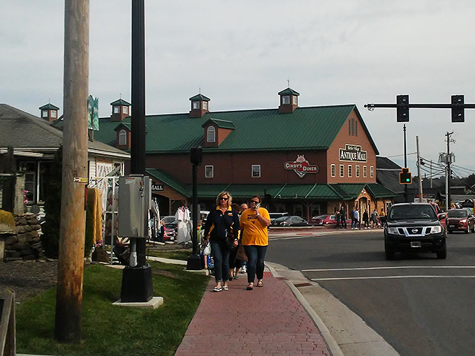 Visitors stroll past Dutch Valley Gifts, where shopping becomes less about acquisition and more about discovering authentic craftsmanship.