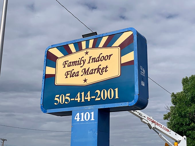 The market's roadside sign promises adventure in classic Americana style. Like a desert mirage, except the treasures are actually real.
