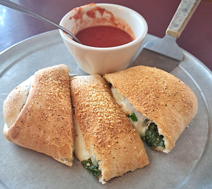 These pillowy calzones with their side of marinara are what happens when bread, cheese, and spinach have a beautiful Italian love affair.