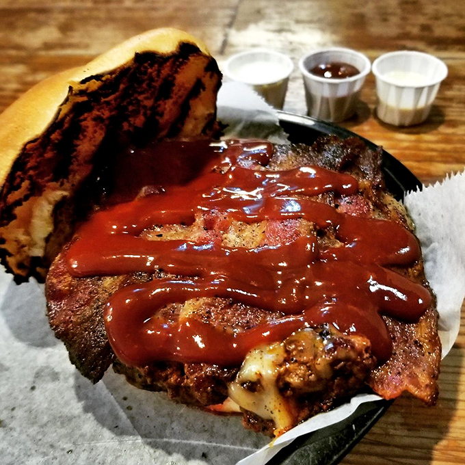 This isn't just a burger—it's a masterclass in smoke, char, and sauce that makes you want to high-five strangers.