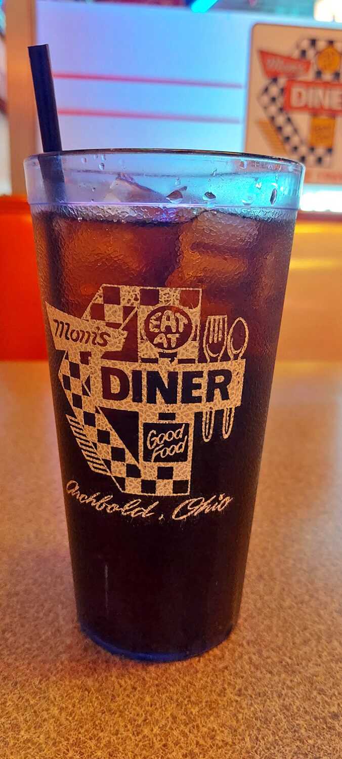 That checkered logo isn't just branding&mdash;it's a promise. Each sip from this glass is a direct line to simpler times when calories weren't counted.