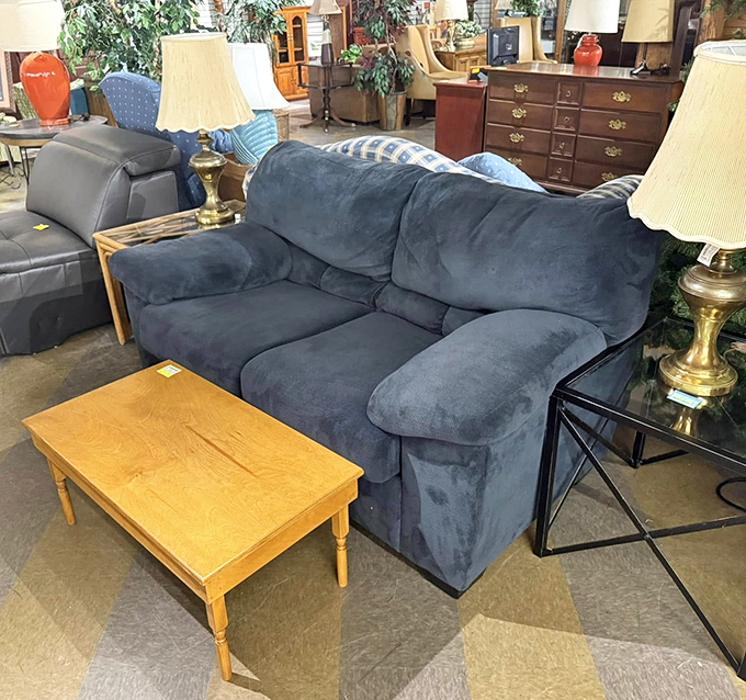 That blue sofa has "Sunday afternoon naps during football season" written all over it. The coffee table's just waiting for your remote control.