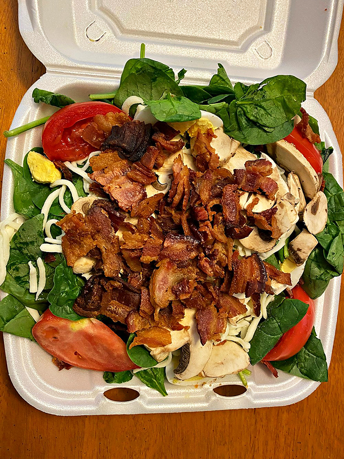 Spinach salad that even Popeye would approve of. The bacon bits aren't just toppings&mdash;they're little flavor bombs of pure joy. 
