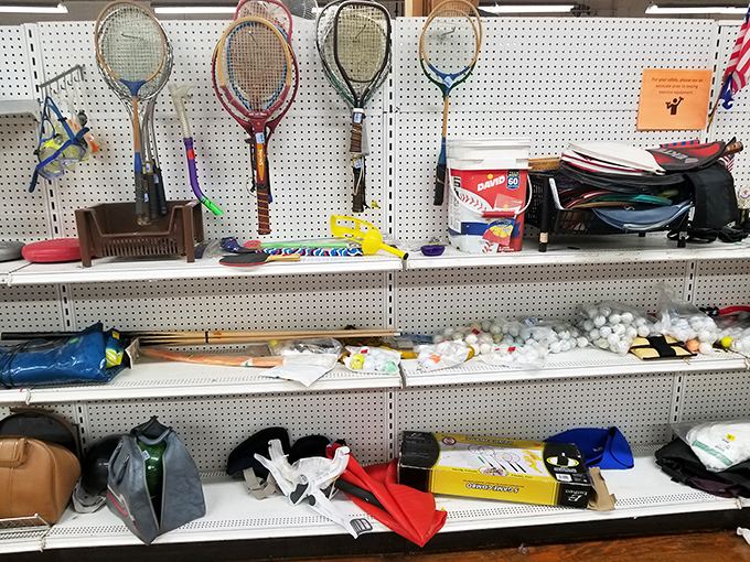Tennis rackets hang like trophies of summers past, waiting for their next match on Michigan courts.