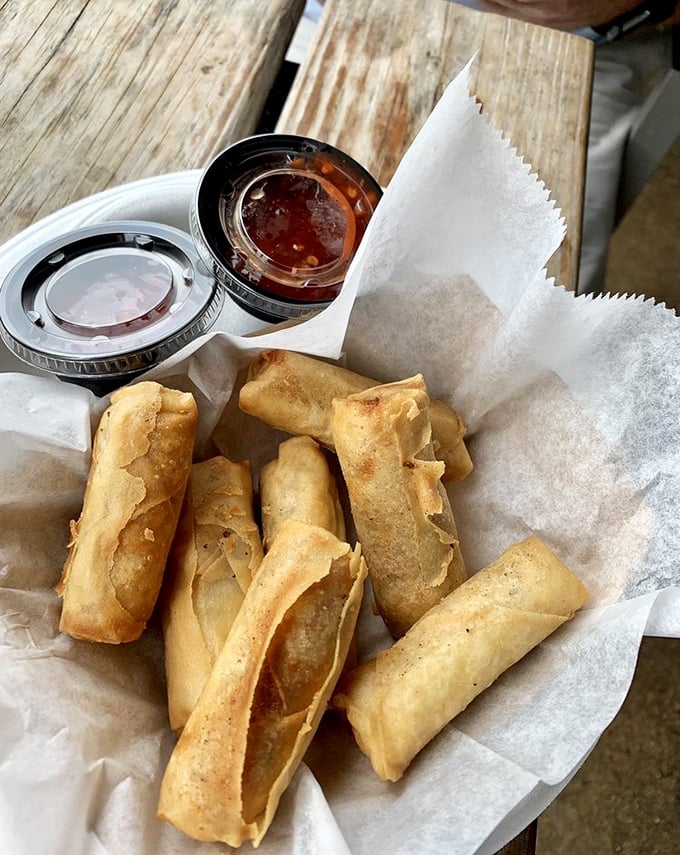 Spring rolls crispy enough to be heard across the table, filled with treasures from both land and sea. Dipping sauces standing by for duty.