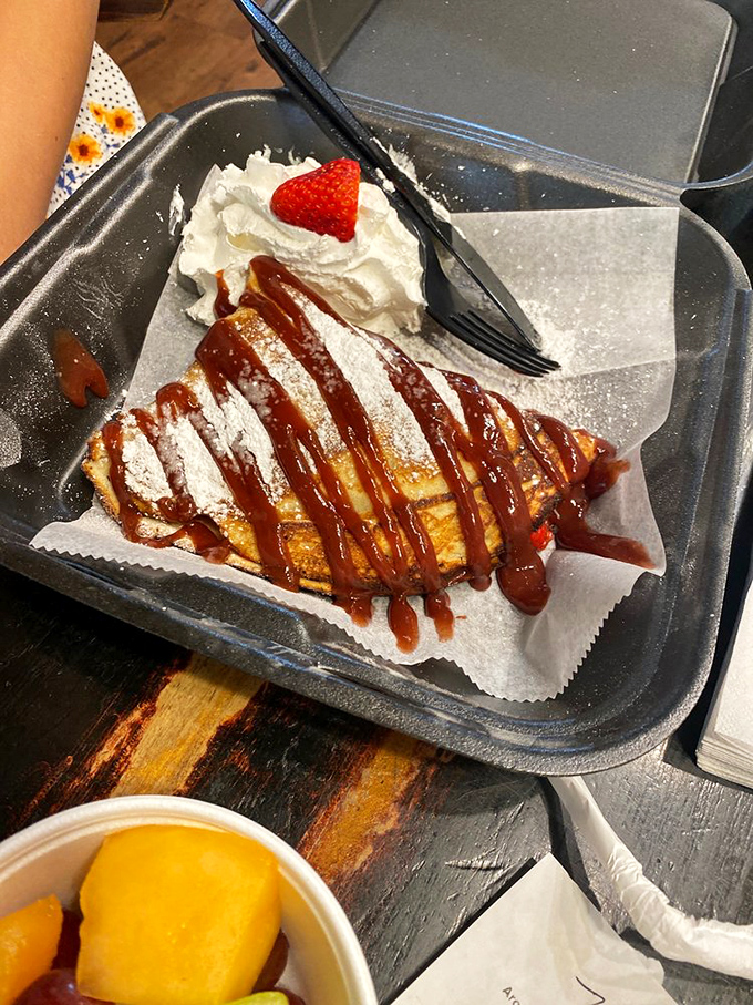 This isn't just a crepe – it's a warm hug drizzled with caramel, topped with whipped cream, and finished with a strawberry crown.