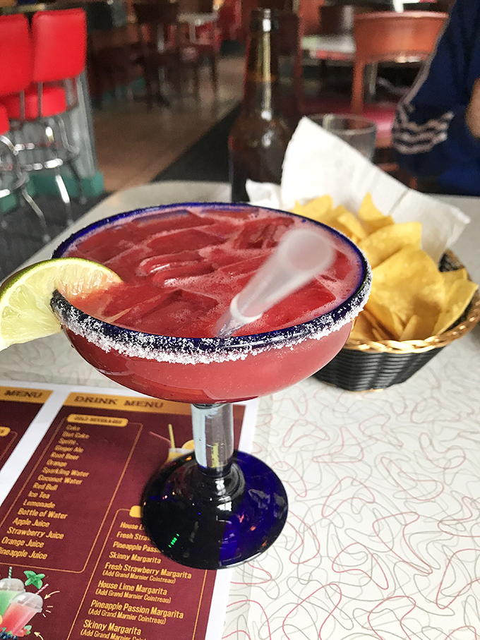 This strawberry margarita isn't just a drink—it's a vacation in a glass, complete with a salty rim that brings you back to earth.