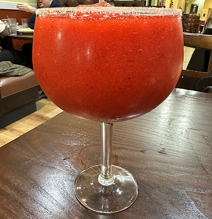 A strawberry margarita so gloriously red it could stop traffic. This goblet of joy comes with the warning: one sip and you'll wonder why you ever ordered anything else.