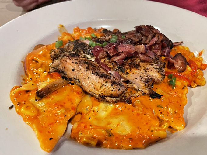 A symphony of colors and flavors! This salmon dish resting on creamy pasta proves that comfort food can also be sophisticated enough for date night.