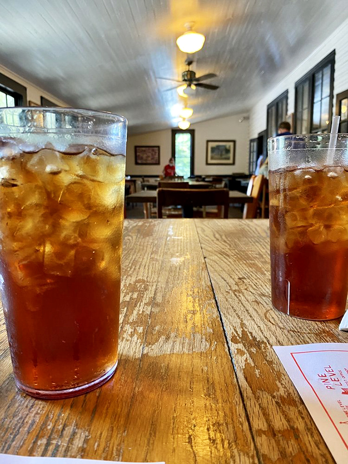 Sweet tea so perfectly amber it could be mistaken for jewelry, served in glasses sweating almost as much as you will after finishing that second helping of cobbler.