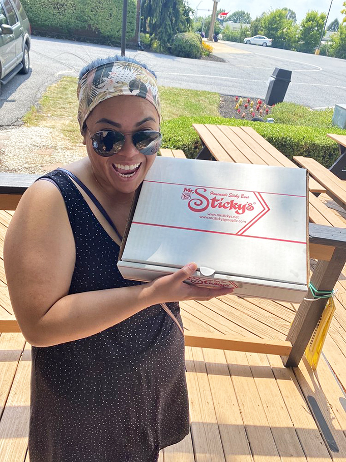 That smile says it all&mdash;the universal expression of "I've scored the motherlode of sticky buns." Pure, unadulterated joy. 