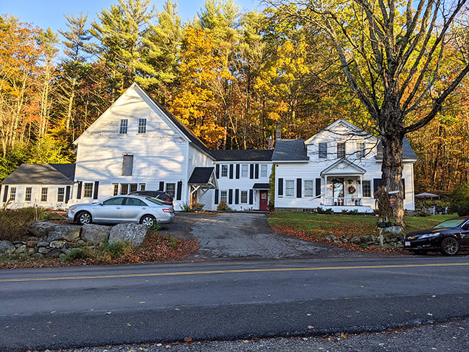 White clapboard with autumn foliage &ndash; if Norman Rockwell painted real estate listings, this classic New England home would be his masterpiece.