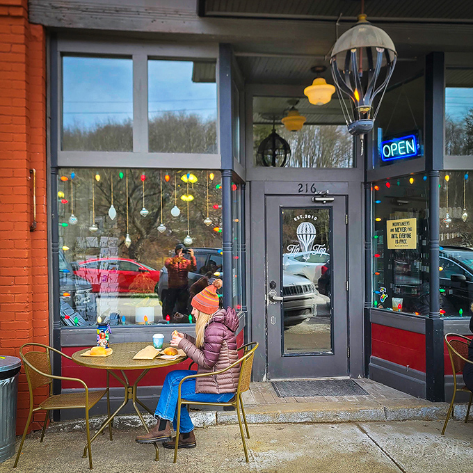 TipTop Coffee Bar welcomes visitors with colorful lights and outdoor seating&mdash;the kind of place where one cup turns into three hours of conversation.