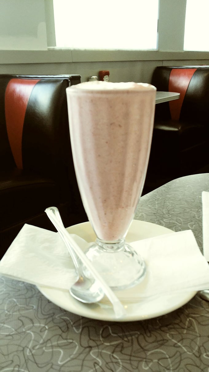 This vanilla milkshake isn't just a drink &ndash; it's a towering achievement of creamy nostalgia served in a glass tall enough to have its own zip code.