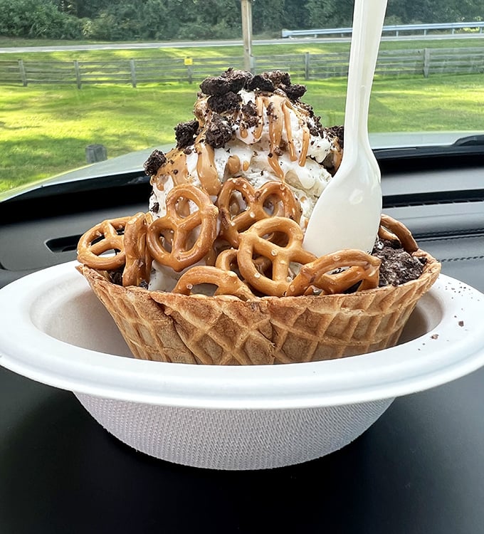 Sweet and salty nirvana in a waffle bowl. Vanilla ice cream gets dressed up with caramel, chocolate crumbles, and pretzels for a party in your mouth.