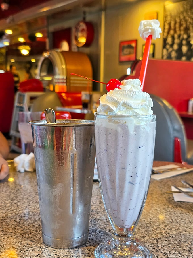 Vanilla shake so thick you could stand a spoon in it, served with that classic metal mixing cup.
