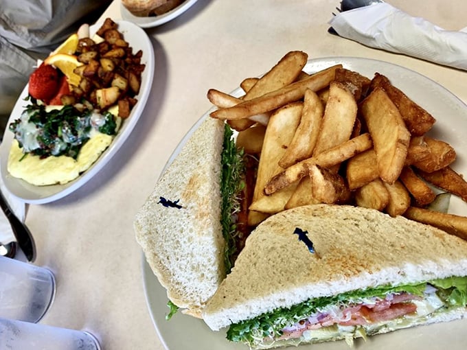 The sandwich that launched a thousand road trips, accompanied by golden fries that crackle with each bite. Lunch perfection achieved.