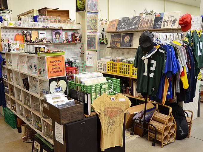 "Records are a sound purchase," indeed! Vinyl treasures waiting to be rediscovered alongside vintage Packers gear.