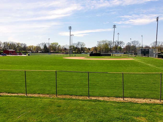 Pristine baseball diamonds await their moment in the spotlight, where local legends are born with each crack of the bat and cloud of dust.