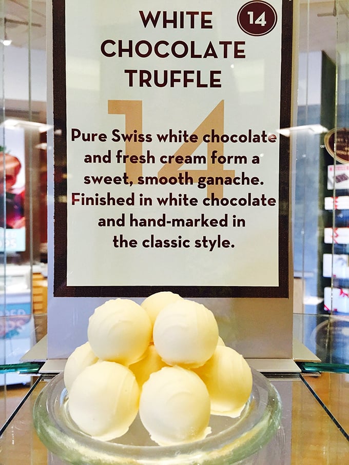 White chocolate truffles gleaming like pearls of sweetness, their smooth ganache centers waiting to melt away your afternoon stress.