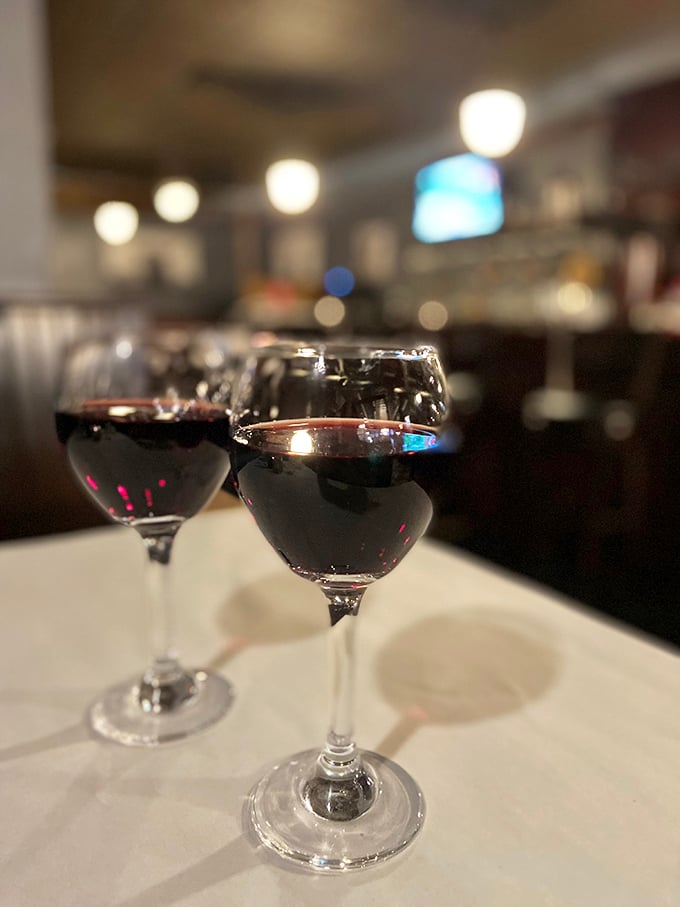 Two glasses of robust red wine waiting to meet their meaty match. The perfect supporting actors in your steakhouse adventure. 
