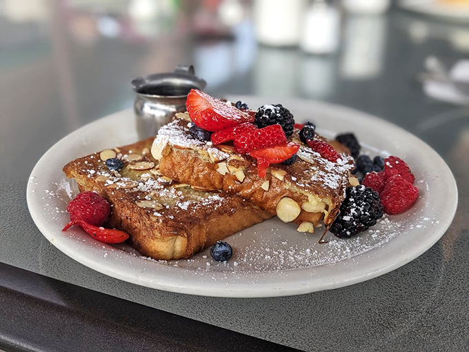 French toast that makes you question all other breakfasts you've ever had. Those berries aren't garnish&mdash;they're supporting actors in a culinary masterpiece.