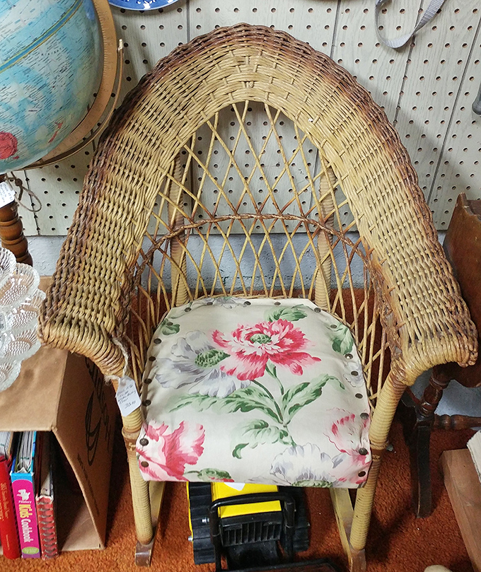 This wicker chair has rocked generations of children to sleep. The floral cushion was definitely someone's pride and joy.