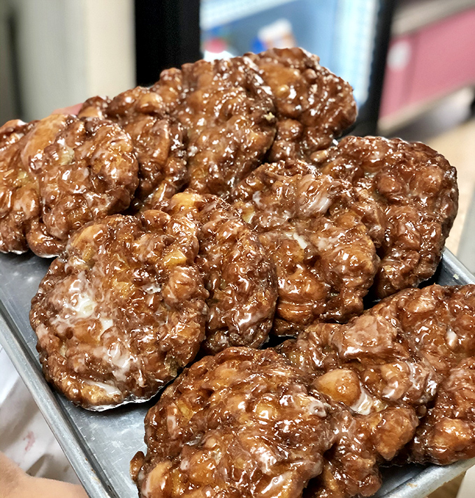 Apple fritters: where "fruit serving" meets "indulgence." These craggy beauties are the geological wonders of the donut world.