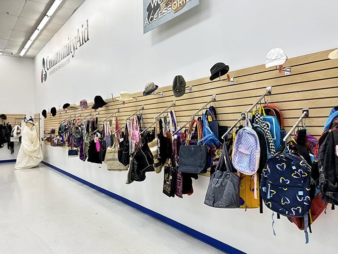 The accessories wall showcases everything from practical backpacks to statement purses, all waiting for their second chance at fashion glory.