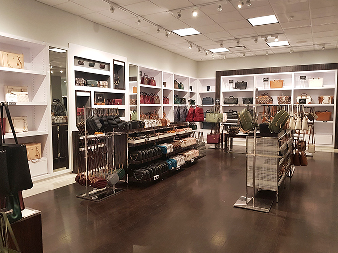 Handbag heaven at the Coach outlet, where leather dreams come true and "practical purchase" gets a creative definition.
