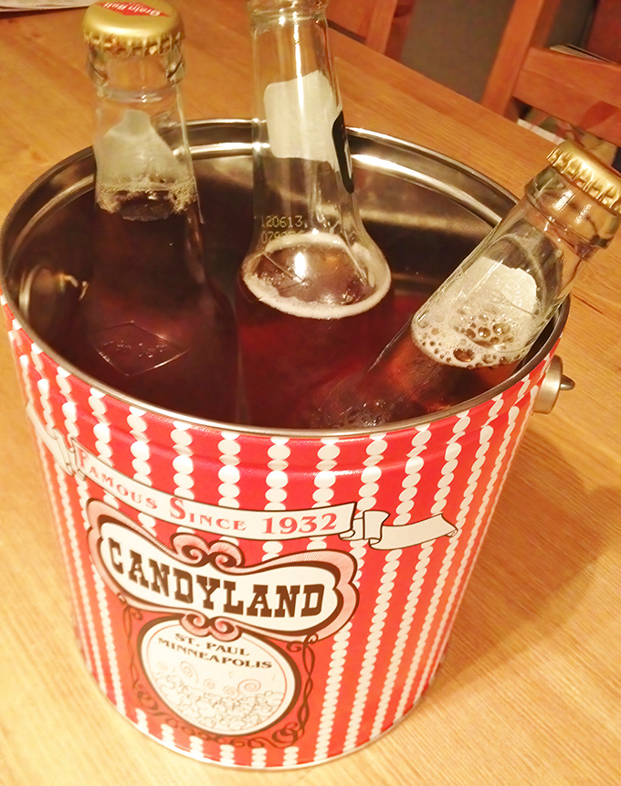 Even the beverages get the Candyland treatment &ndash; old-fashioned sodas chilling in a vintage bucket that screams "summer afternoon."