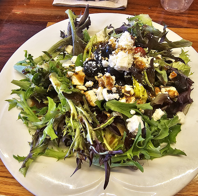 This isn't just a salad; it's a colorful rebellion against boring lettuce. Fresh greens, feta, and walnuts create a symphony in every bite.