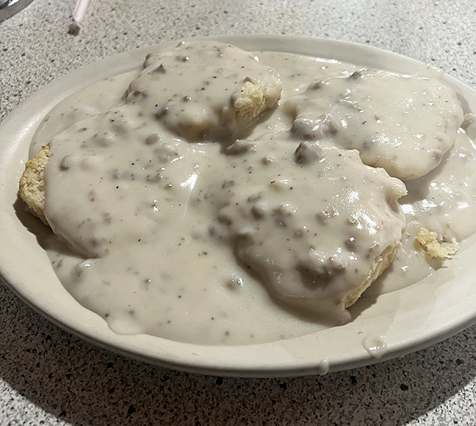 Biscuits and gravy so authentic they should come with their own Southern accent. This plate has comforted more souls than a lifetime of therapy sessions.